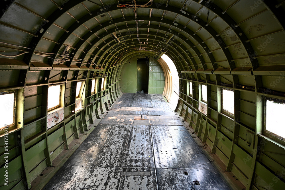 Fuselage of the inside of a military green plane during the war era ...