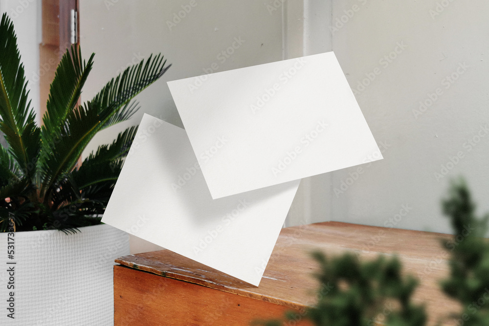 Clean minimal A5 flyer mockup floating on wooden bench background with ...