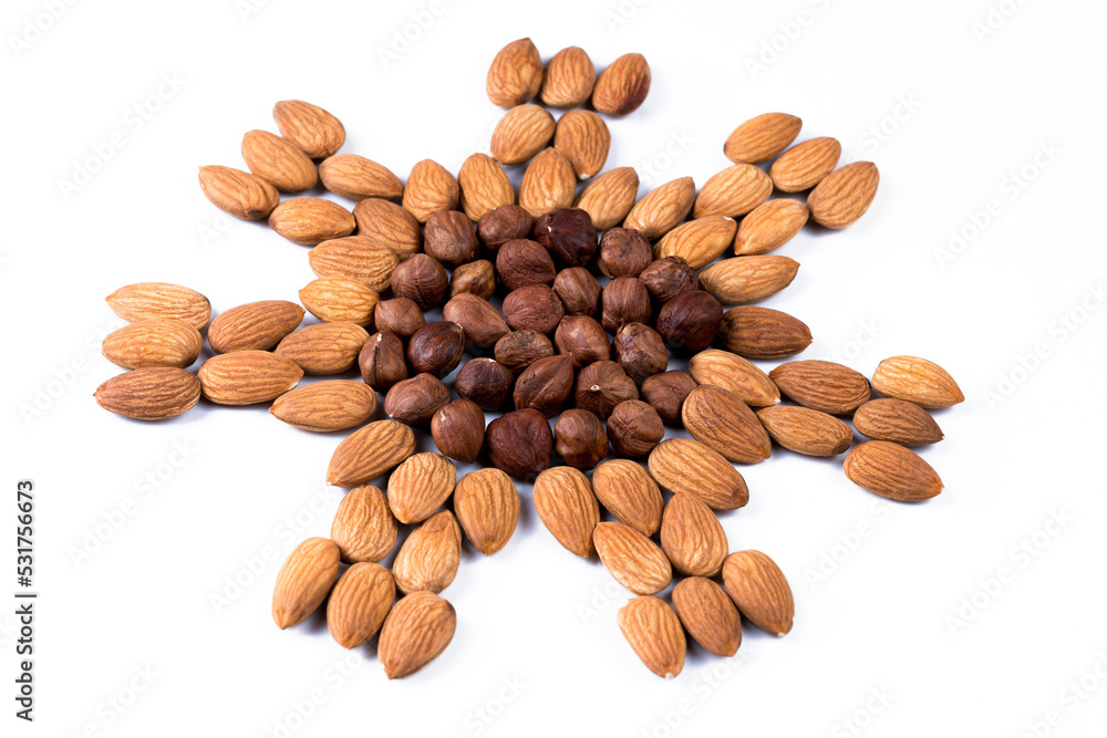 Figure of almond nuts in the shape of a sun. Symbol of natural healthy ...