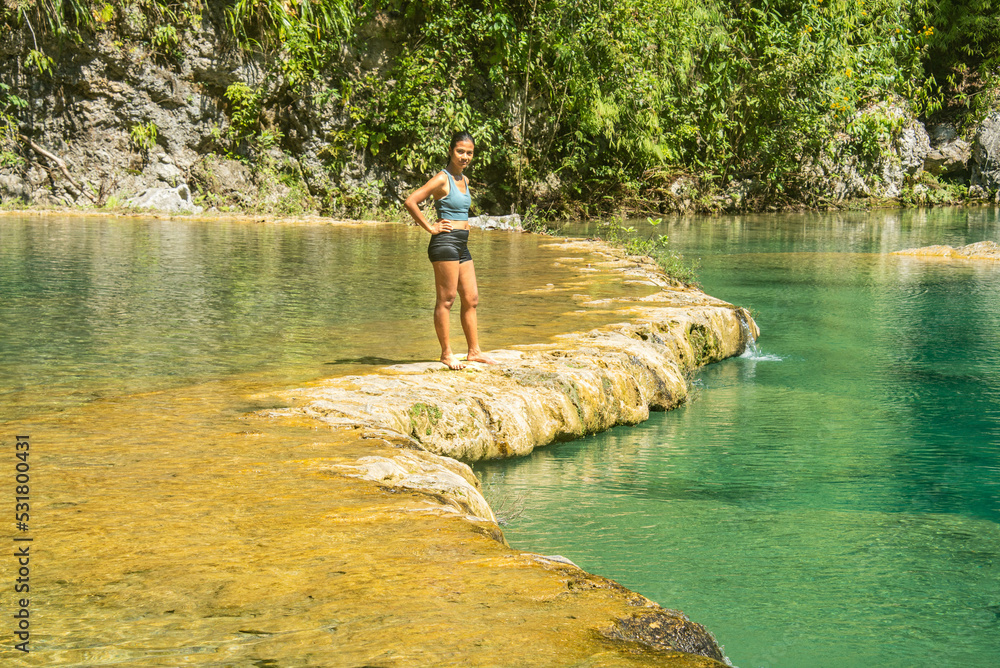 Tourist enjoying the turquoise pools of Semuc Champey, Rio Cabohon ...