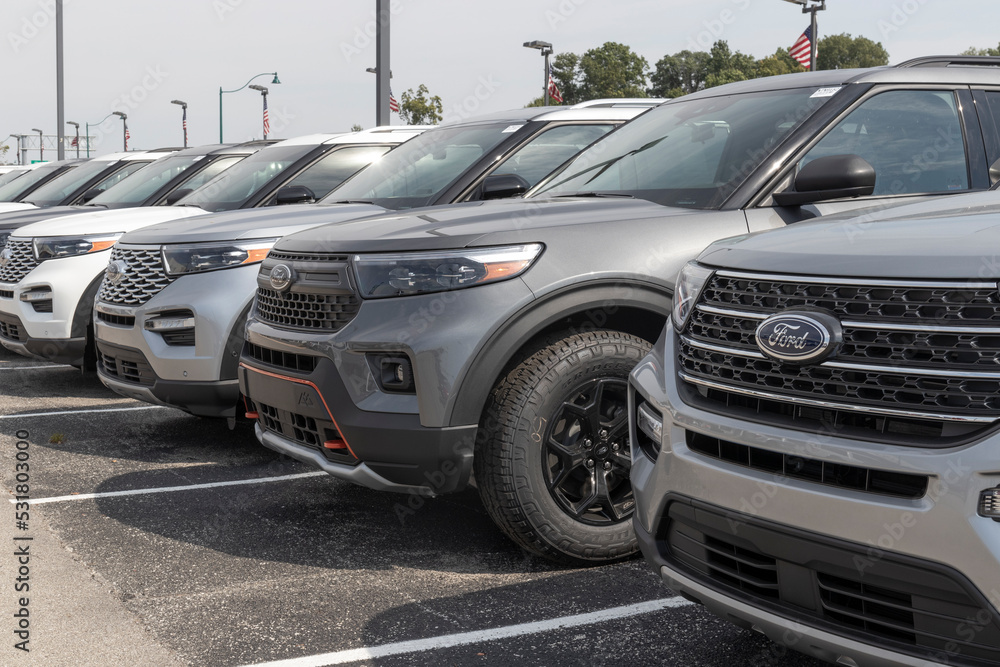 Ford Explorer display at a dealership. Ford offers the Explorer in a ...