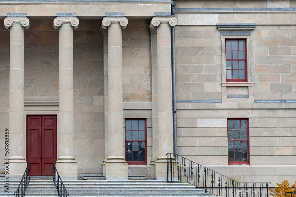 The exterior facade of a historic government building with large ...