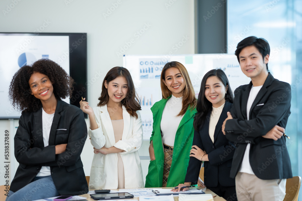 Young businessman and a beautiful Asian businesswoman stand with her ...
