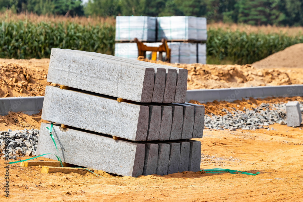 Pavement repairs and paving slabs laying on the prepared surface, with ...