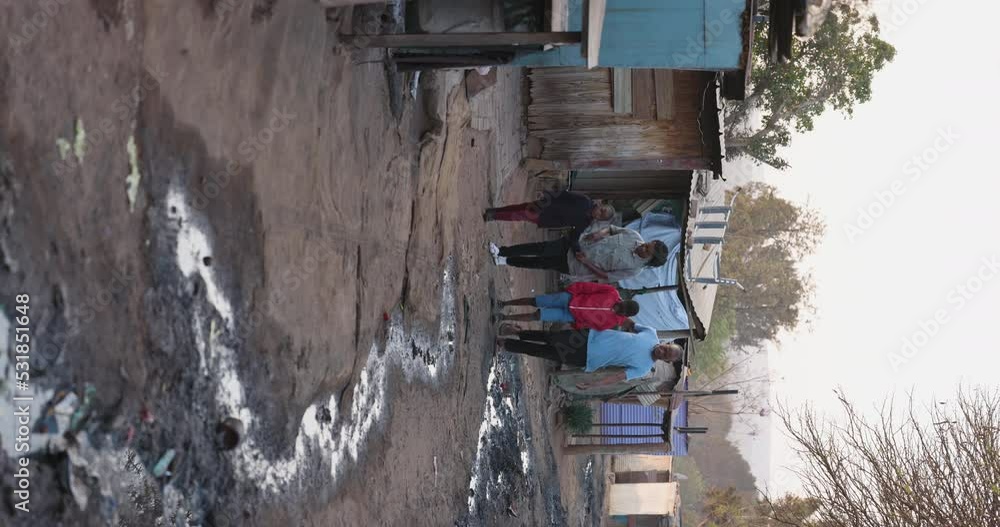 Vertical video.Poverty. Inequality. Poor Black African family walking ...