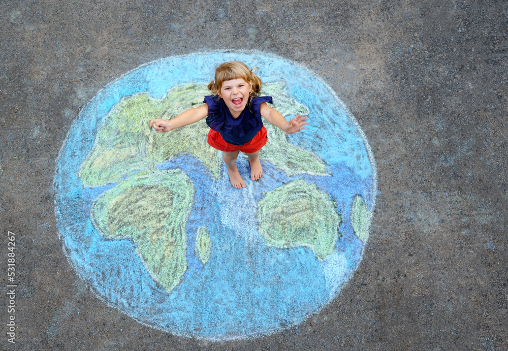 Little preschool girl with earth globe painting with colorful chalks on ...
