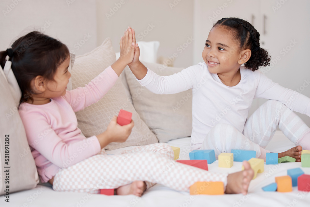 High five, children and fun playing with learning blocks and ...