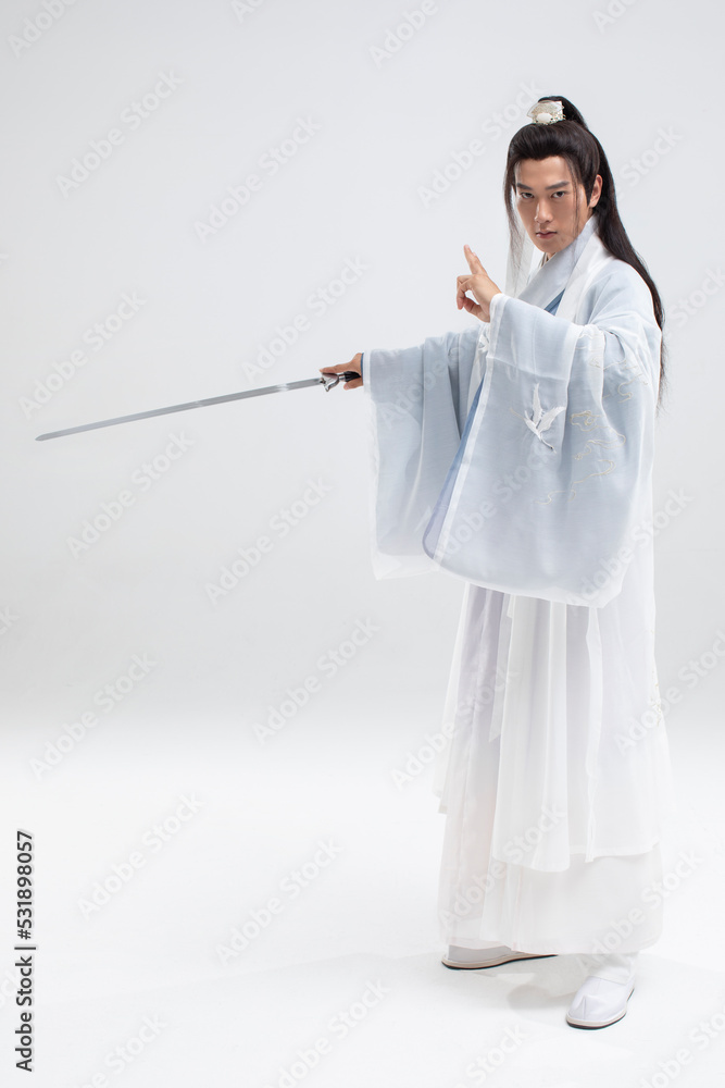 Young swordsman in ancient costume Stock Photo | Adobe Stock