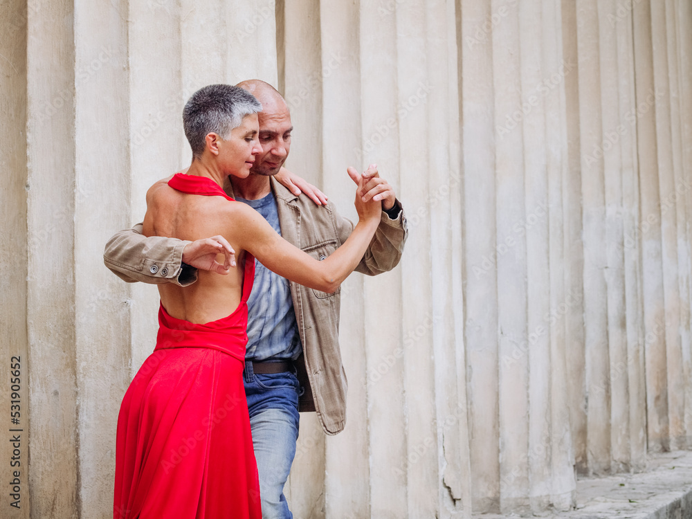 Tango nuevo dance - the famous partner dance with a woman in a red ...