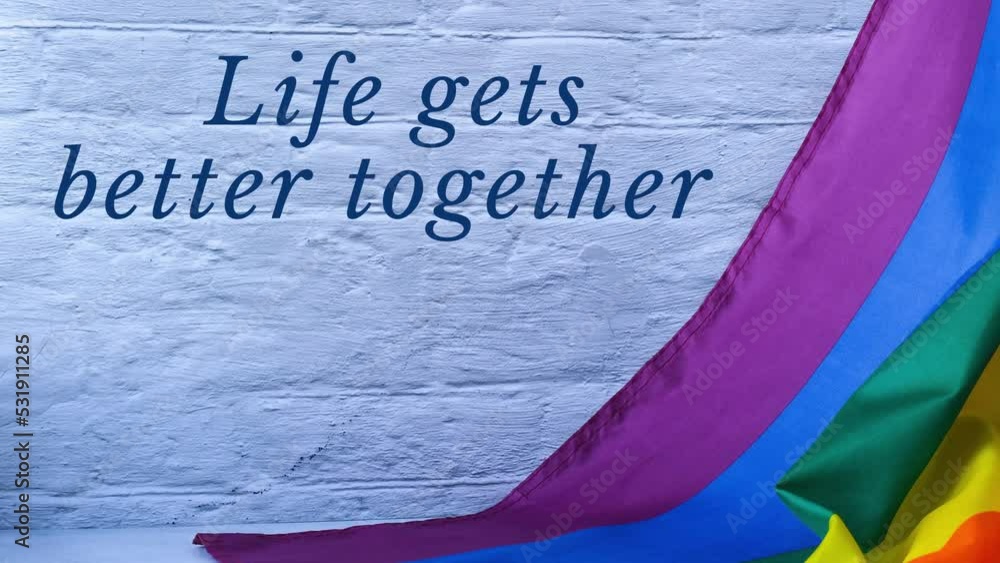 4k zoom in out Rainbow flag with text LIFE GETS BETTER TOGETHER message ...