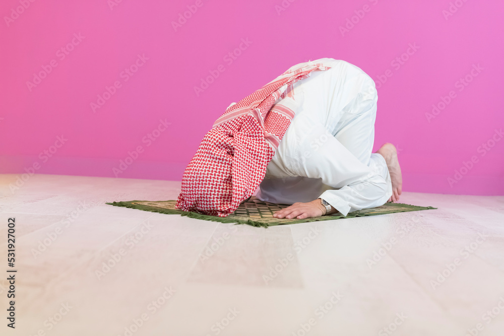 Young muslim man praying salat during Ramadan Stock Photo | Adobe Stock