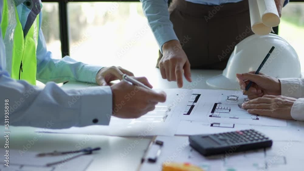 Architect or engineer are designing house, modifying plan, creating ...