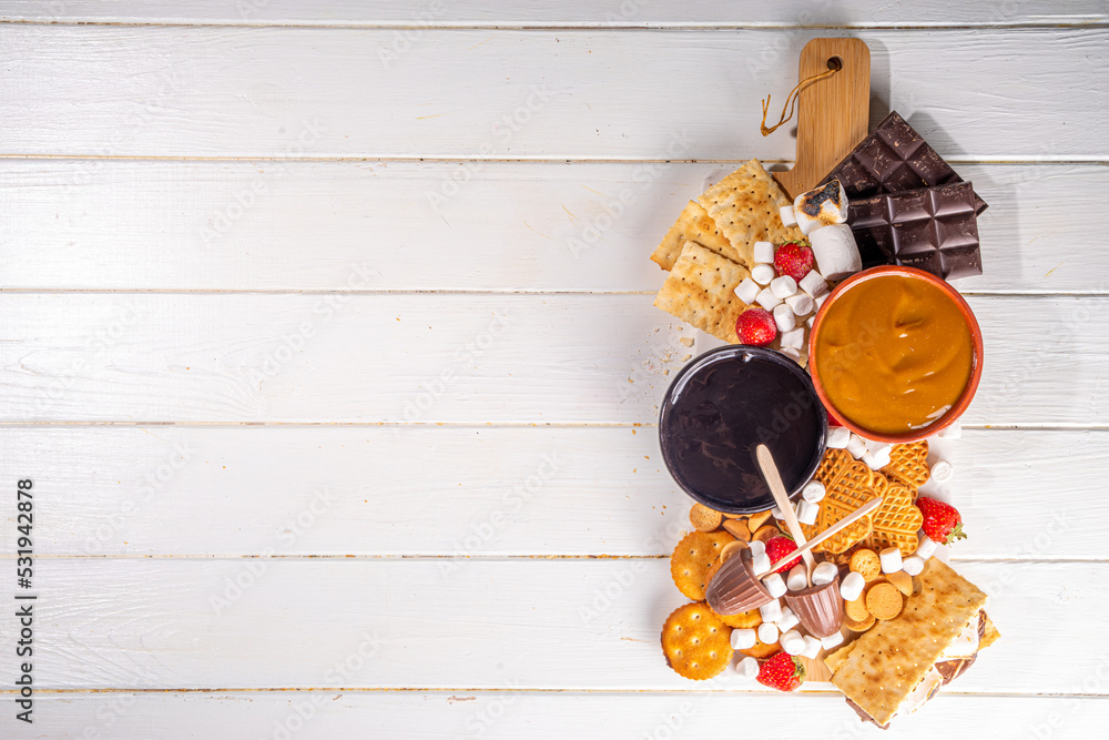 S'mores home party food and ingredients. Smores buffet background with ...