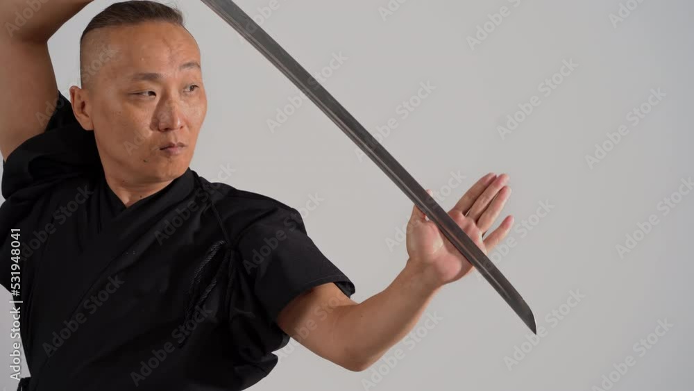 Japanese man traditional dress, black kimano katana samurai sword ...