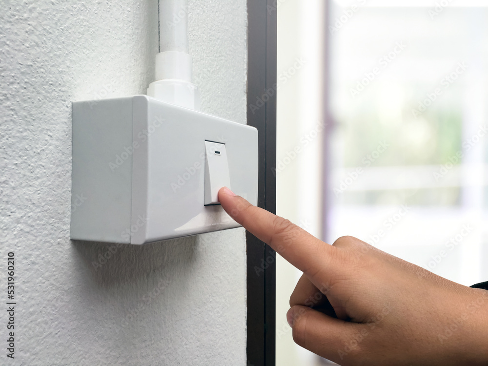 Human finger on the switch on and switch off panel, concept for turn ...