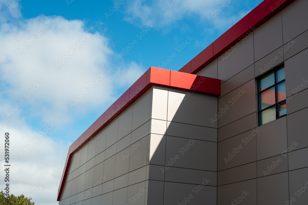 The exterior wall of a contemporary commercial style building with ...