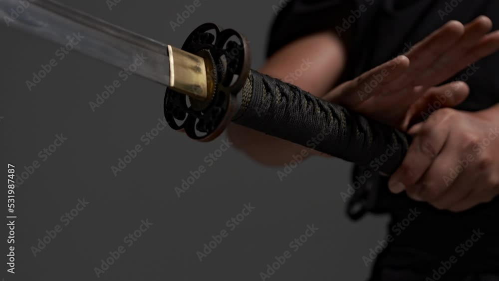 Japanese, black traditional kimano samurai, wars, touches sheath katana ...