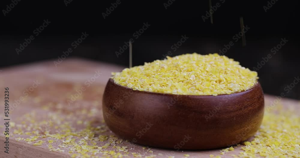 Crushed corn kernels for making corn flakes Stock Video | Adobe Stock