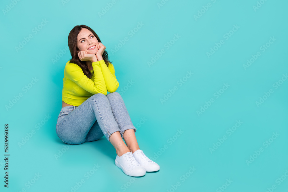 Full body portrait of cheerful pretty lady sit floor hands touch ...
