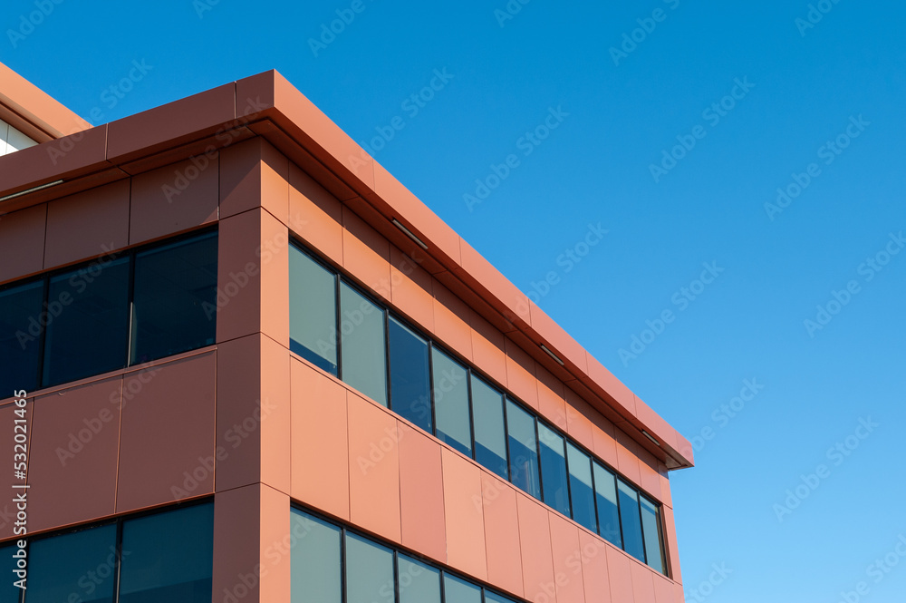 The exterior wall of a contemporary commercial style building with ...