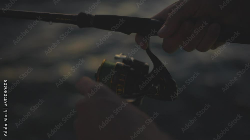 Video „Fisherman holding fishing rod with reel close-up. Angler with ...
