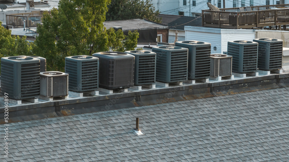 Row of high capacity air-conditioning units on a rooftop Stock Photo ...