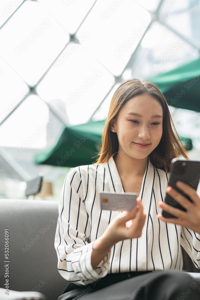 Close up photo of young asian beautiful female lady making a payment ...