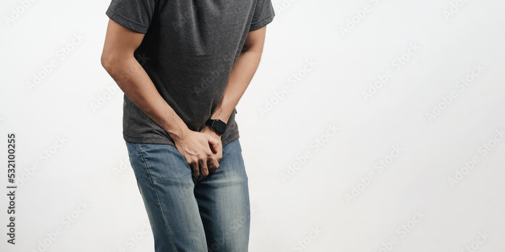 Young man holding his crotch suffering from Diarrhea, incontinence ...