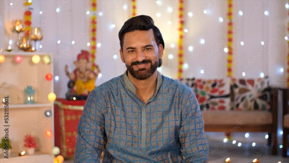 Diwali season decoration - A young Indian model with a beard smiling ...