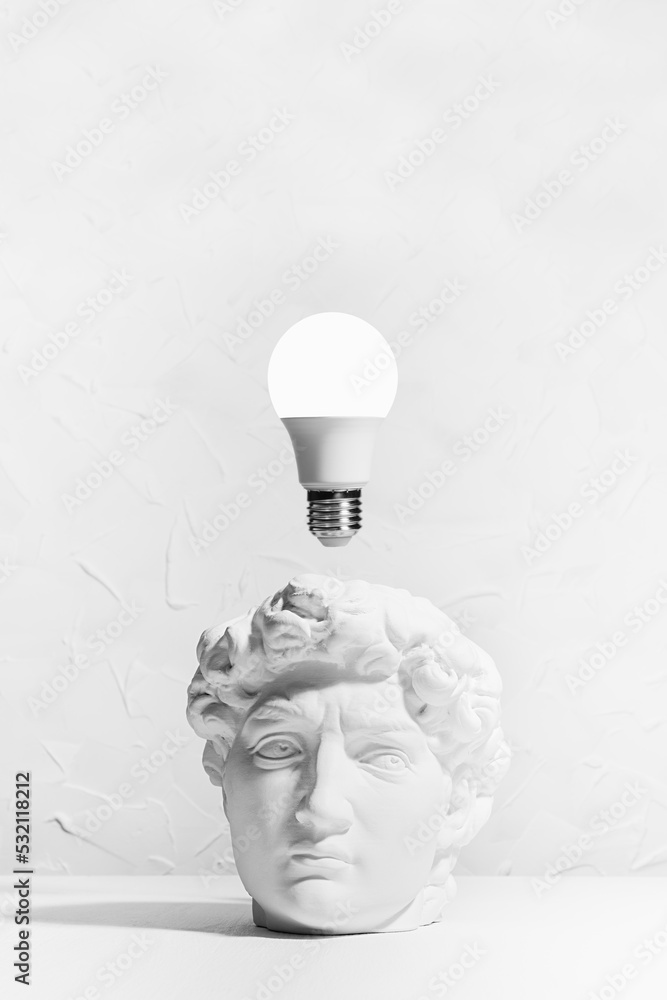 Foto Stock Brainstorming concept with glow light bulb over head of ...
