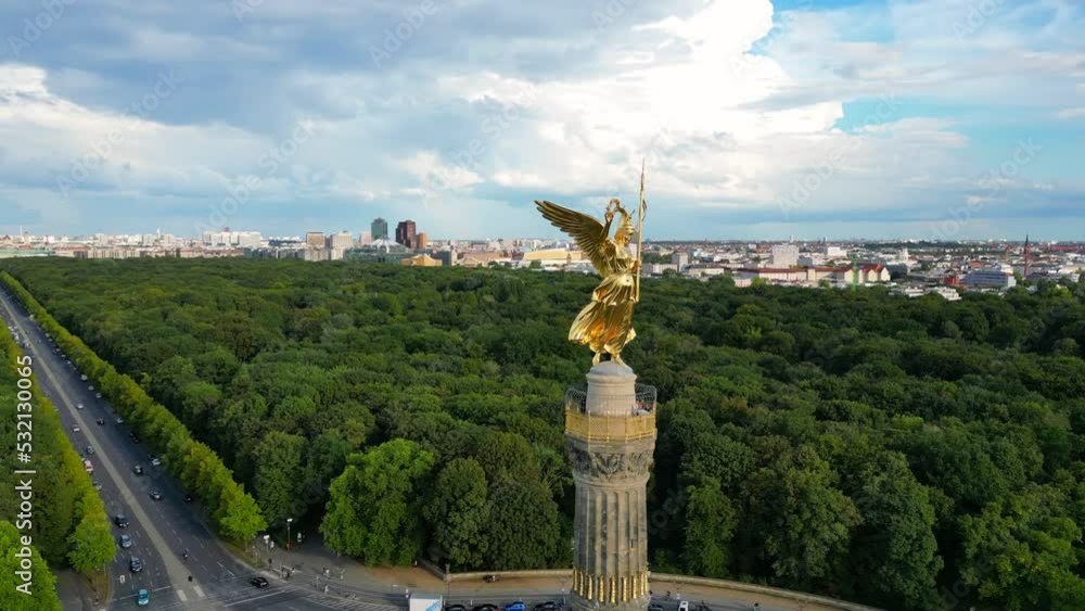 Golden victory column over green Tierarten. magic aerial view flight ...