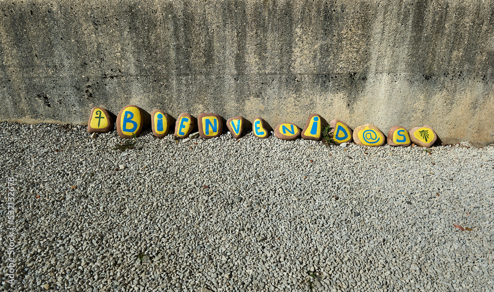 welcome message written each letter on a stone at the entrance to the ...