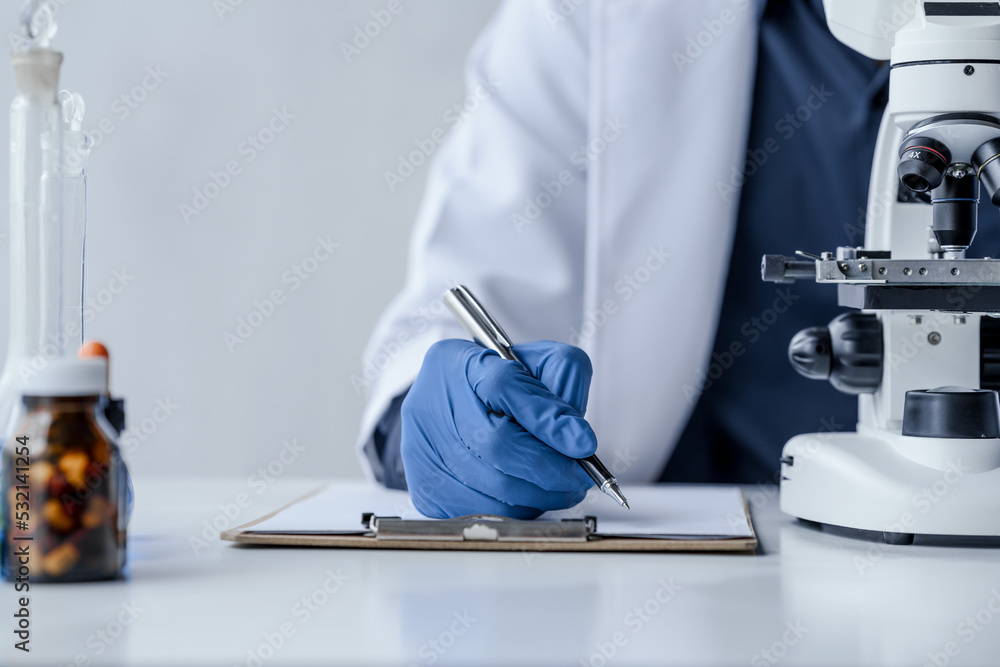 Laboratory and science experiments, chemical hand taking a blood sample ...