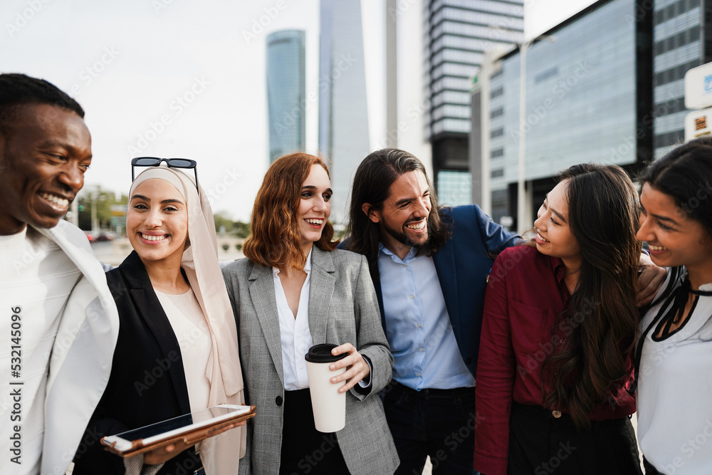 Multiracial business people working outdoor from office building ...