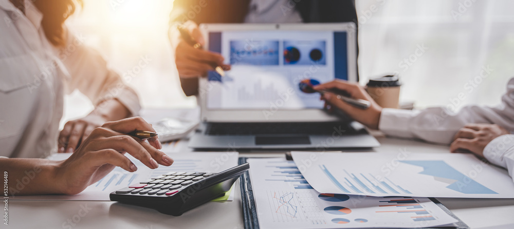 Young colleagues discuss business brainstorming and price charts ...