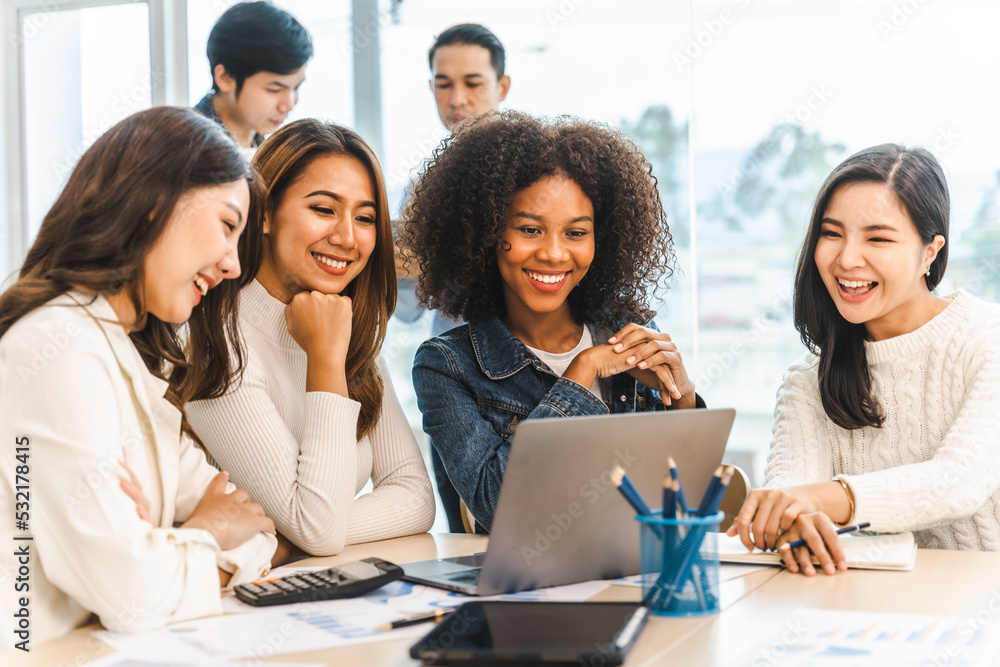Young and successful mixed race, asian business people working on ...