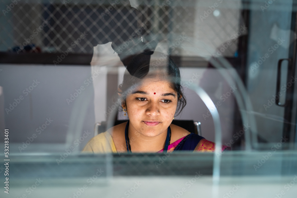 bank employee busy working on cash counter at bank - concept of banking ...