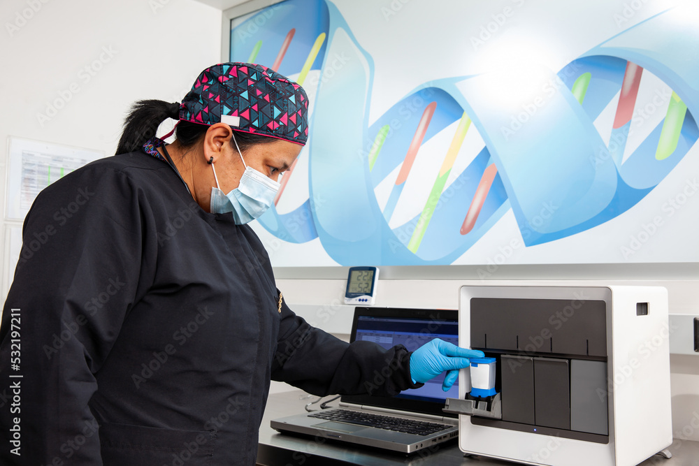 Female scientist working at the laboratory with a thermal cycler ... Female scientist working at the laboratory with a thermal cycler ...