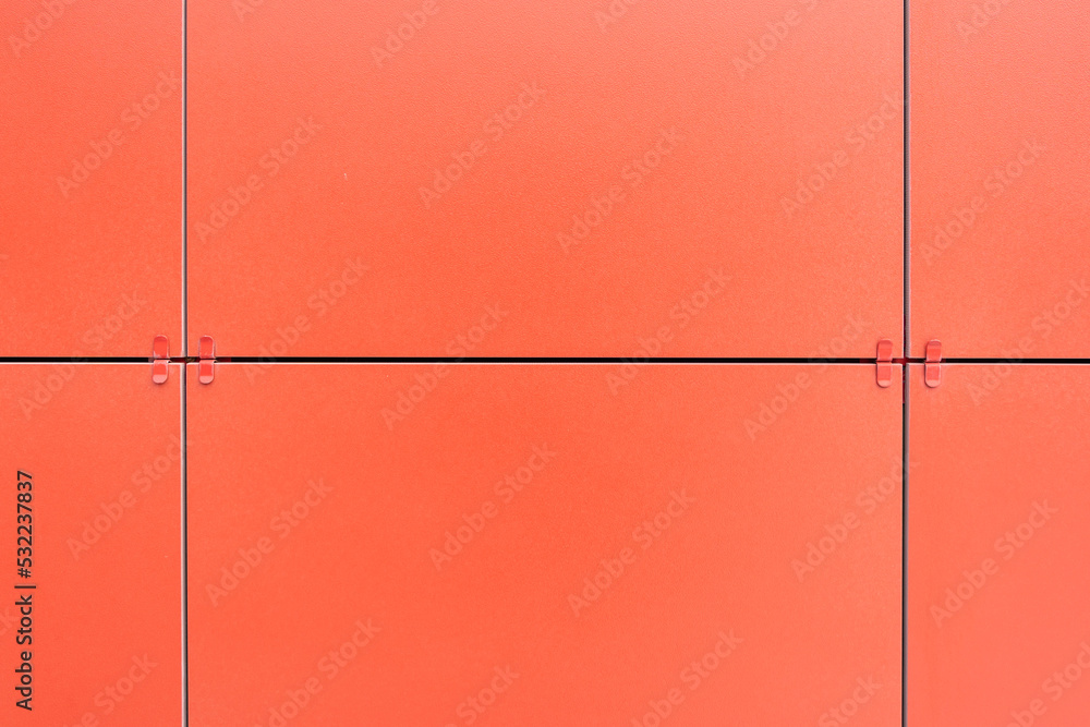 REd square ventilated ceramic panels installed on the facade of the ...