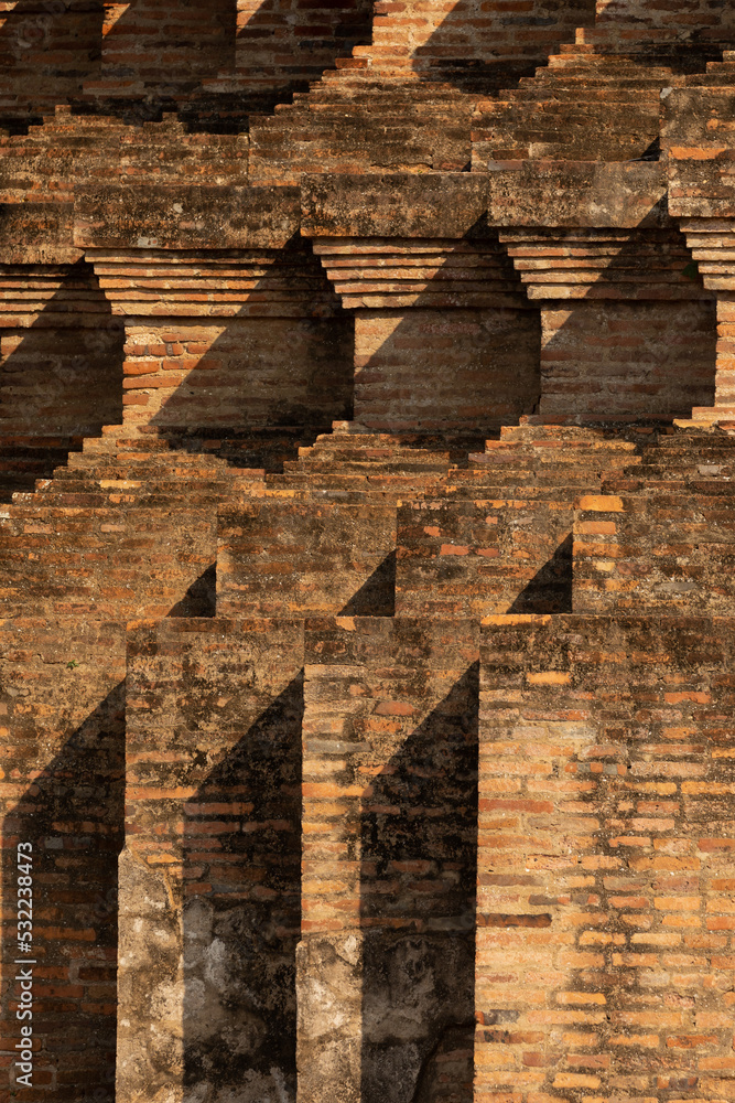 Ancient brick and shadows texture background of the Wat Mahathat temple ...