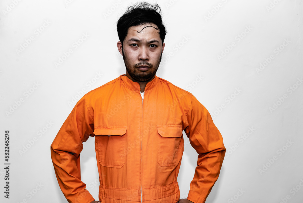 Prisoner in orange robe concept,Portrait of asian handsome man in ...
