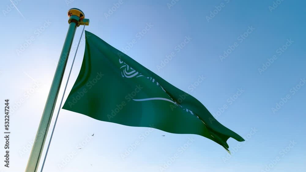 Flag of Saudi Arabia waving in the wind, sky and sun background. Saudi ...