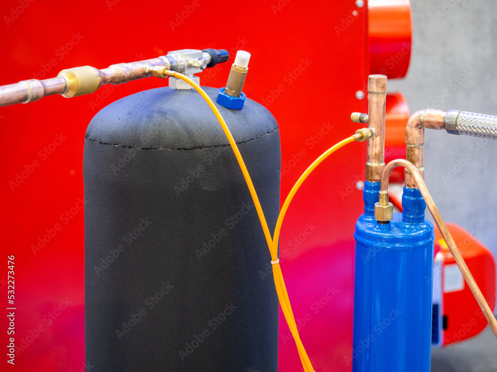 Fragment of equipment for fire safety. Two cylinders with thin tubes ...
