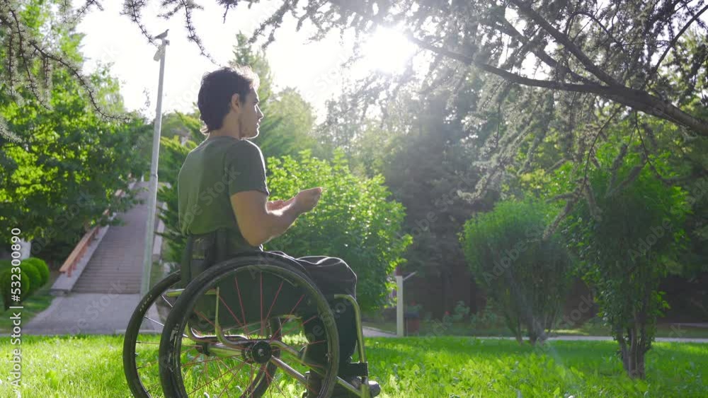 Disabled youth sitting in a wheelchair praying. Prayer. Young disabled ...