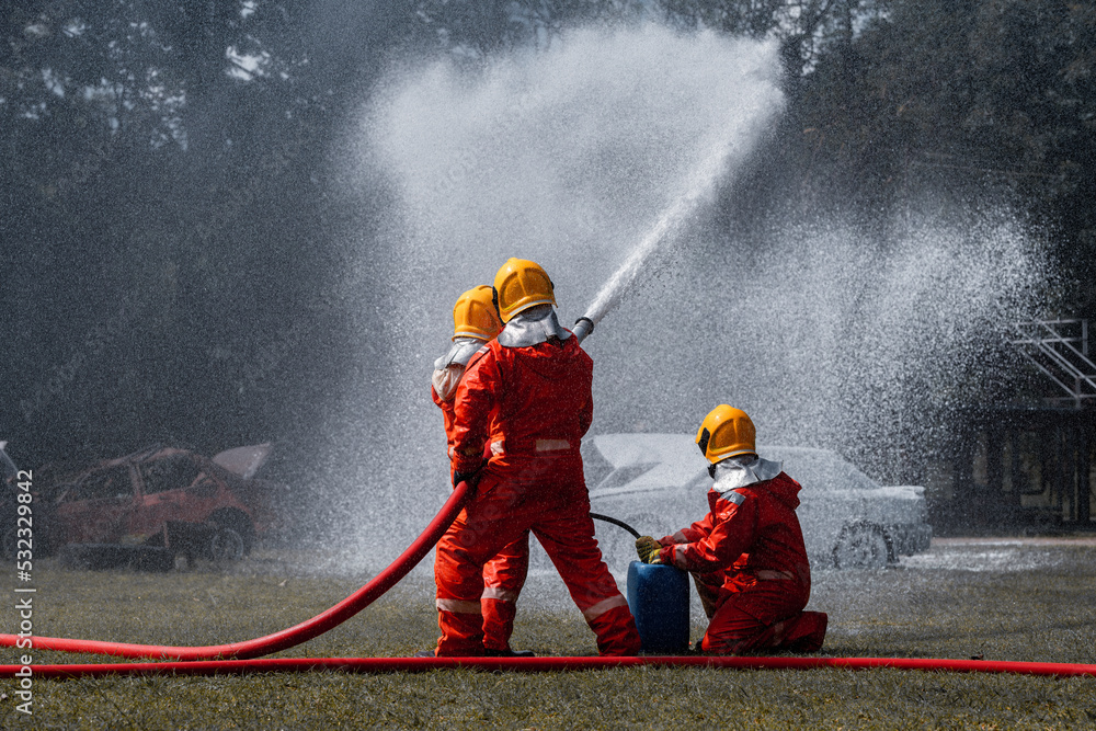 Firefighters safety using twirl water fog type fire extinguisher to ...