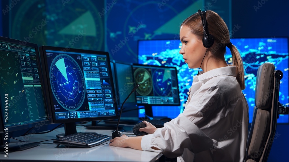 Workplace of the air traffic controllers in the control tower. Team of ...