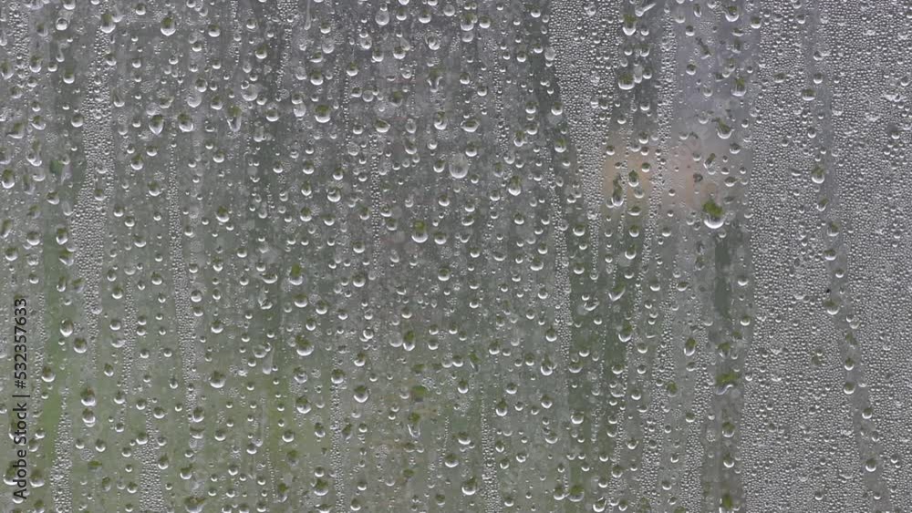 Water droplets clinging to transparent objects caused by condensation ...