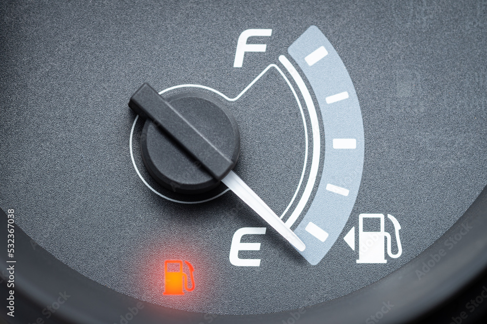 Pointer at the low level point of the fuel tank and the red light ...