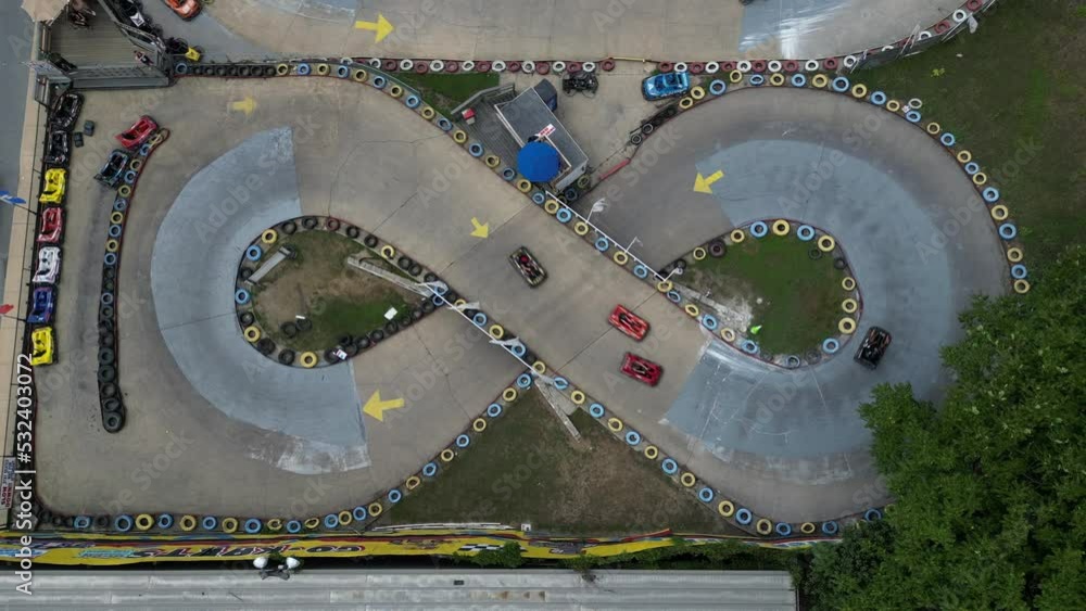 A top down view, directly above a go-kart race track in the shape of ...