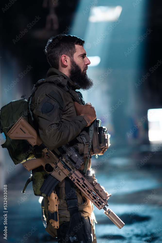 Army soldier in Combat Uniforms with an assault rifle and combat helmet ...